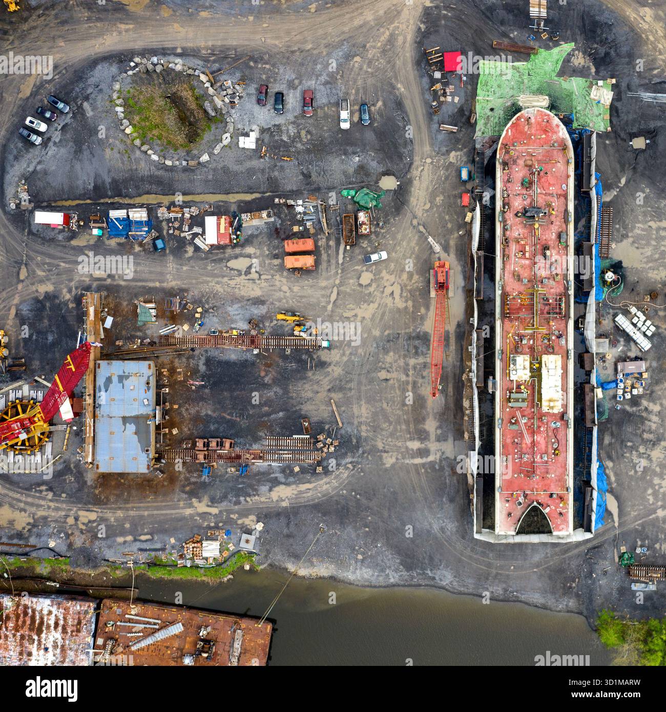 Aerial view of a dry dock where a ship is under repair, surrounded by ...