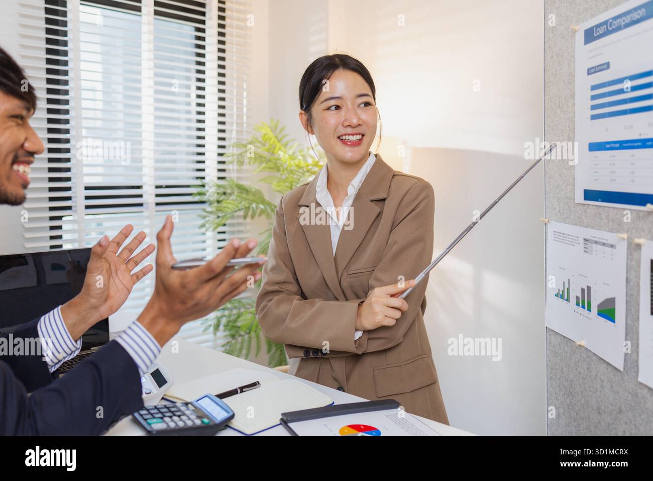 Business colleagues are actively engaged in a collaborative meeting ...