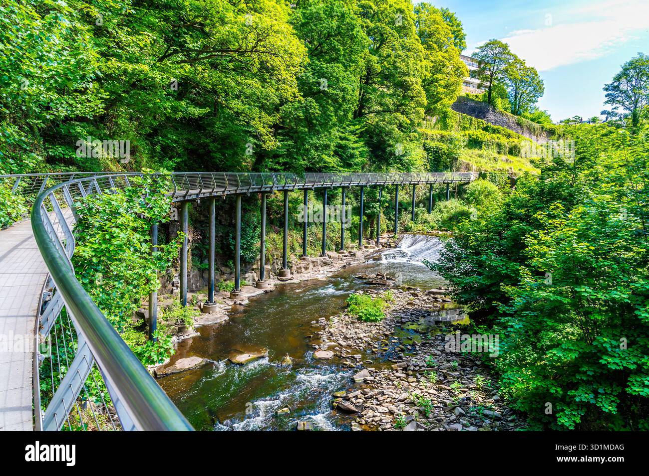 A view along the walkway beside a disused mill in the Torrs Riverside ...