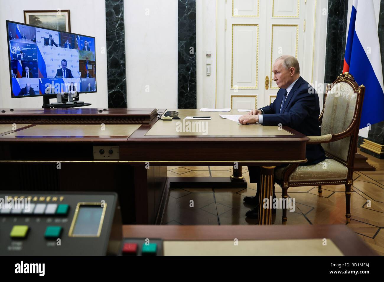 Russian President Vladimir Putin leads a cabinet meeting via ...