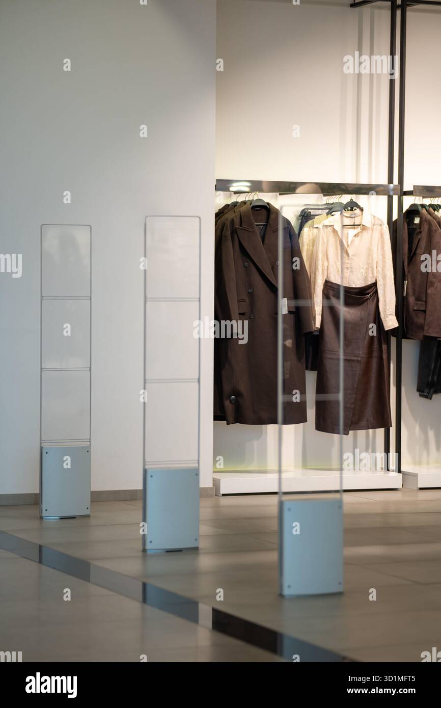 A sleek, transparent security gate stands at the entrance of a modern ...