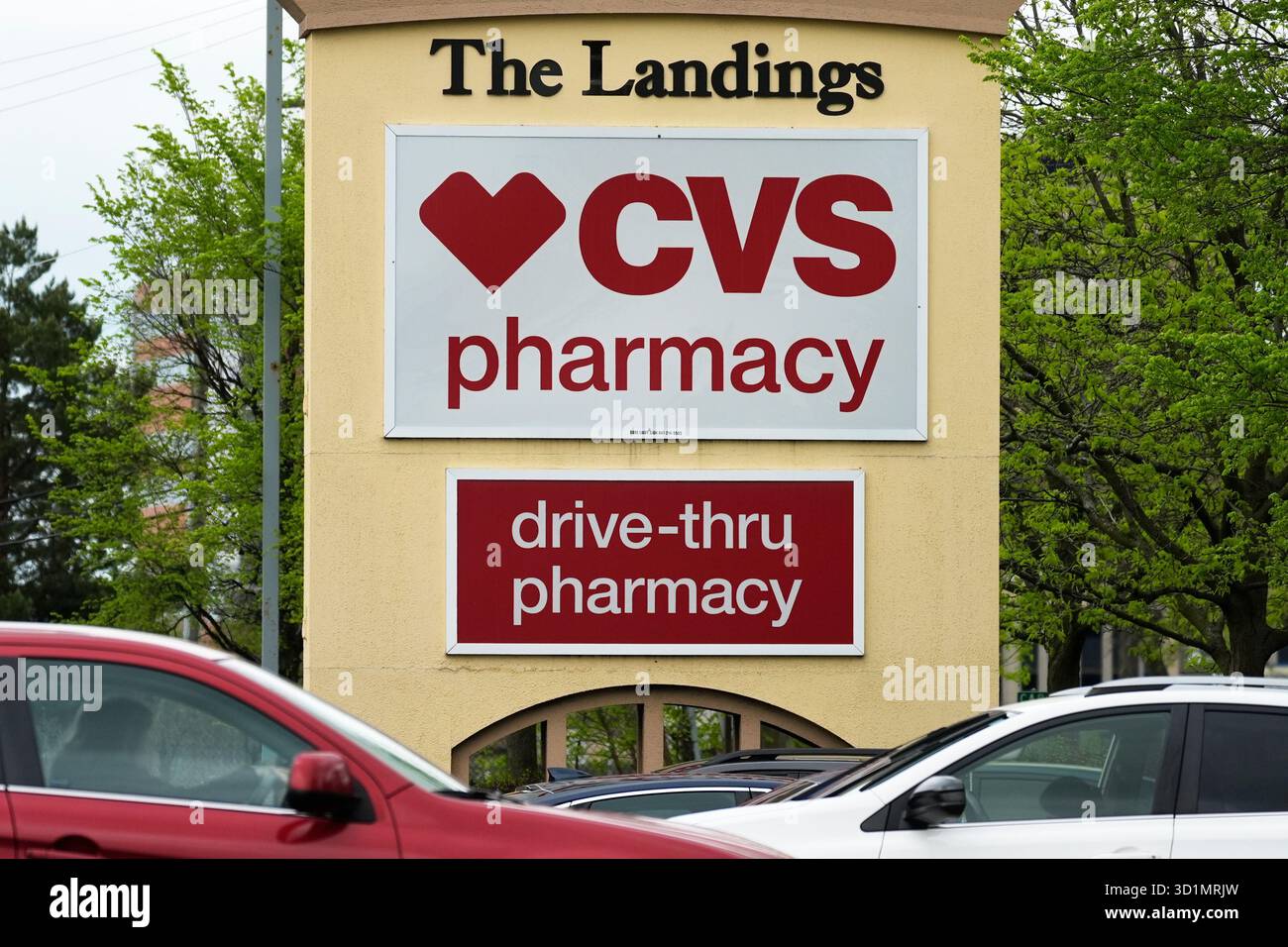 FILE - CVS pharmacy and drive-thru signs are seen outside of CVS store ...