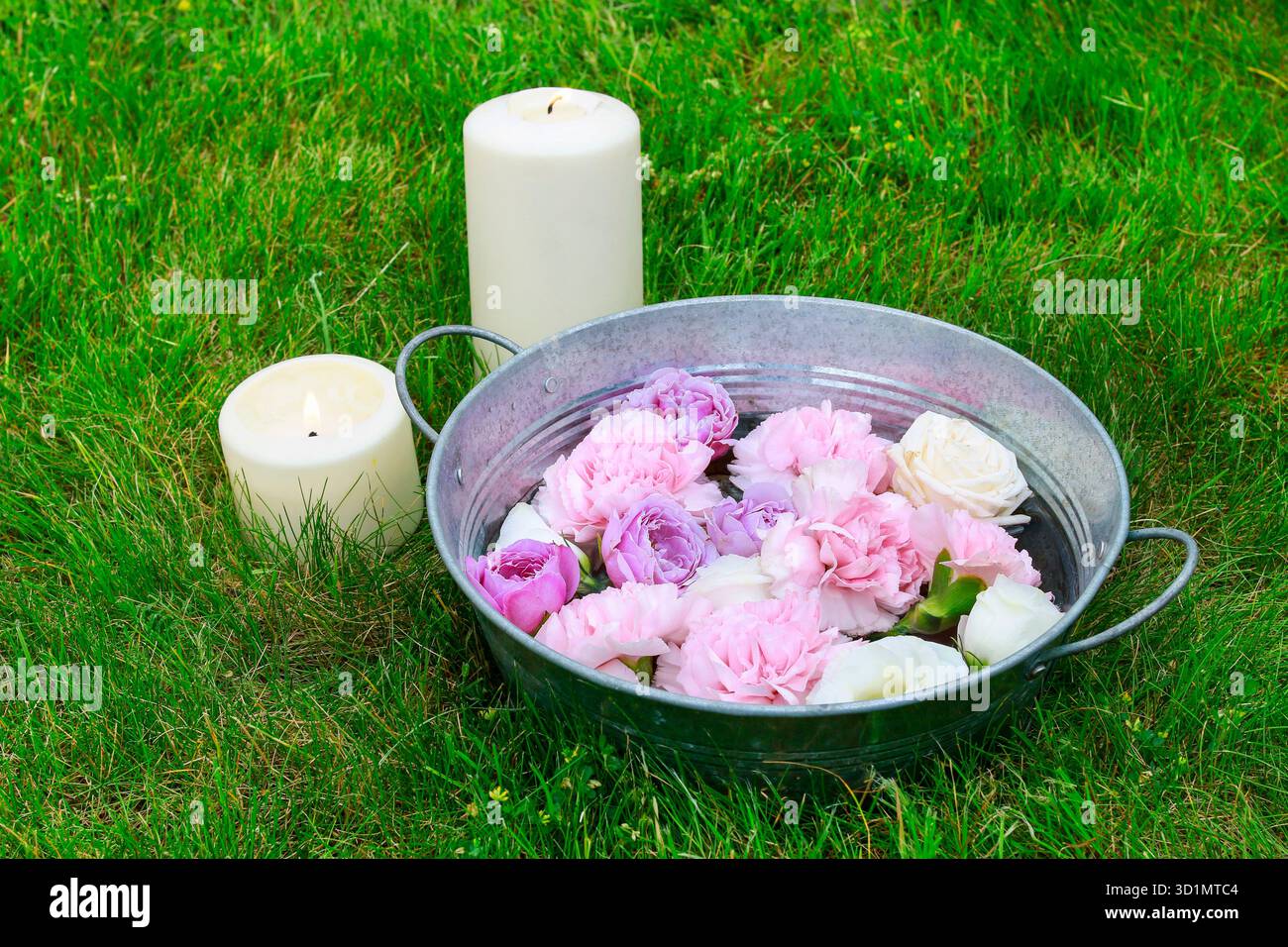 Garden party decorations: silver bucket with floating flowers Stock ...