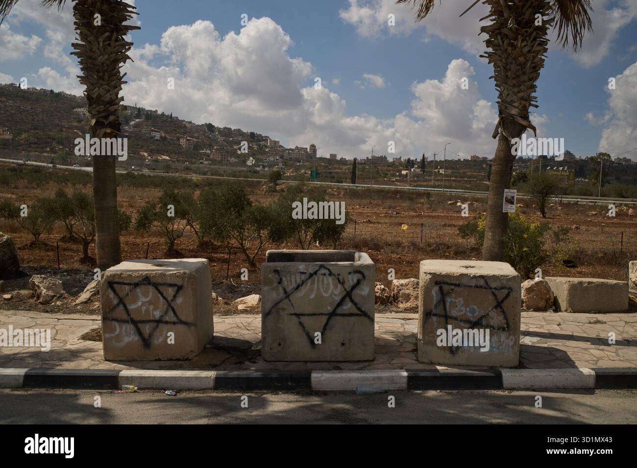 Concrete blocks set up by Israeli authorities are seen next to a gate ...