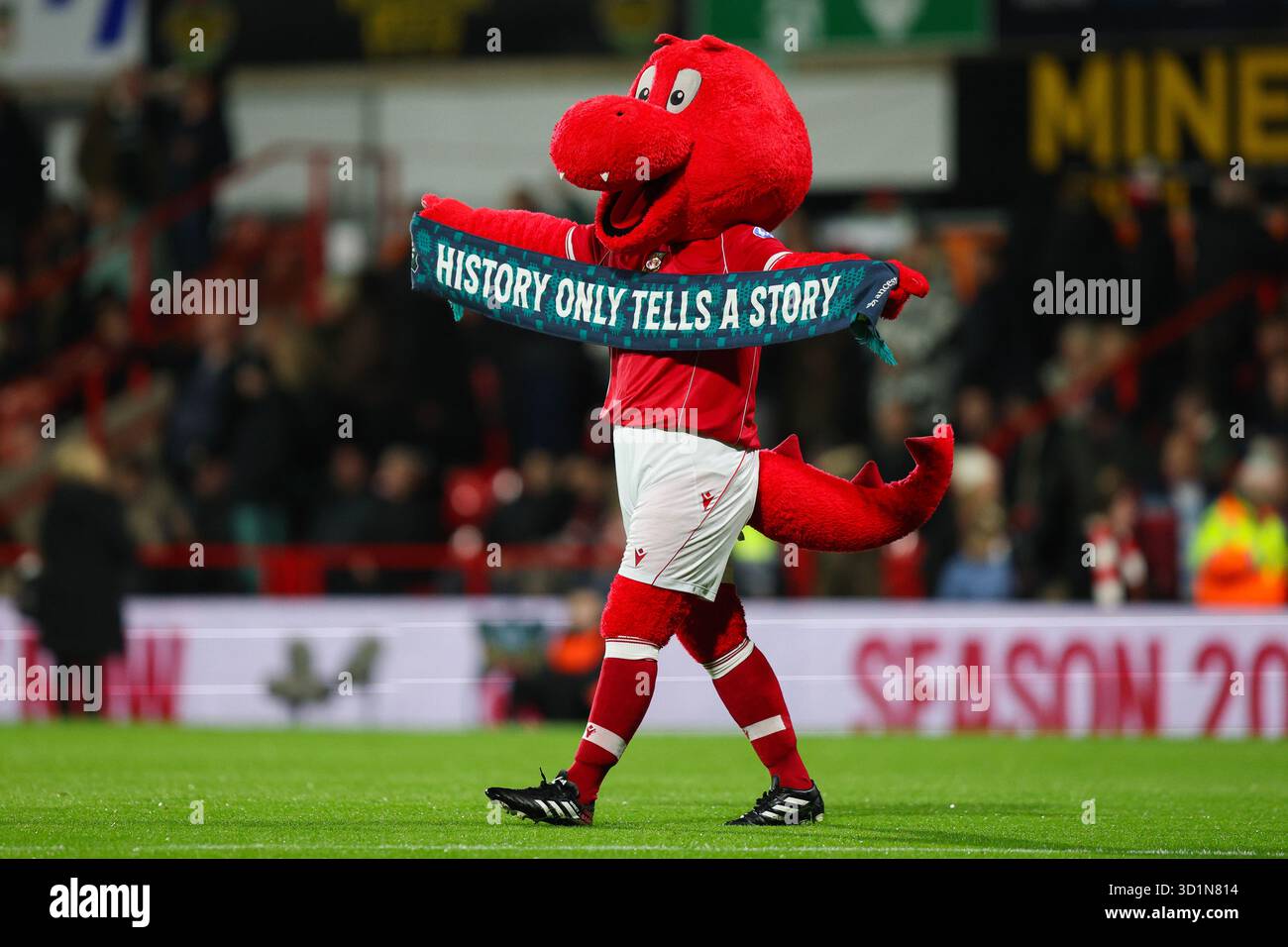 Wrexham, Wales, 28th October 2025. Wrexham mascot Wrex with a banner ...