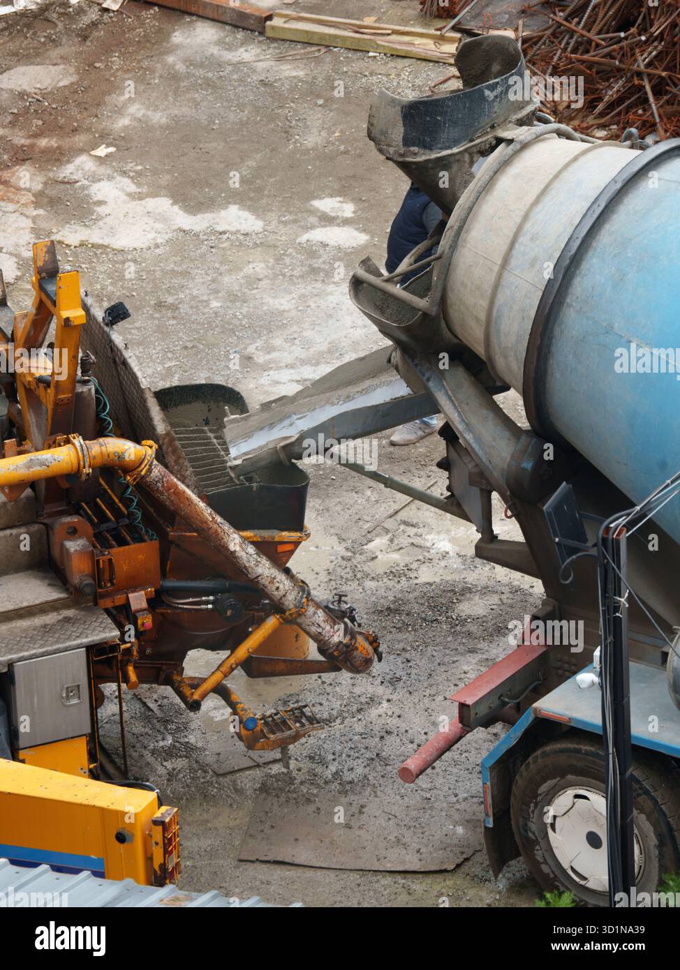 Concrete Pouring from Mixer Truck into Pump Hopper Stock Photo - Alamy