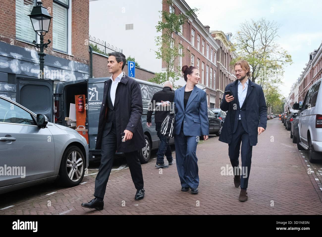 Rob Jetten, leader of the center-left D66 party, left, leaves a polling station after casting ...