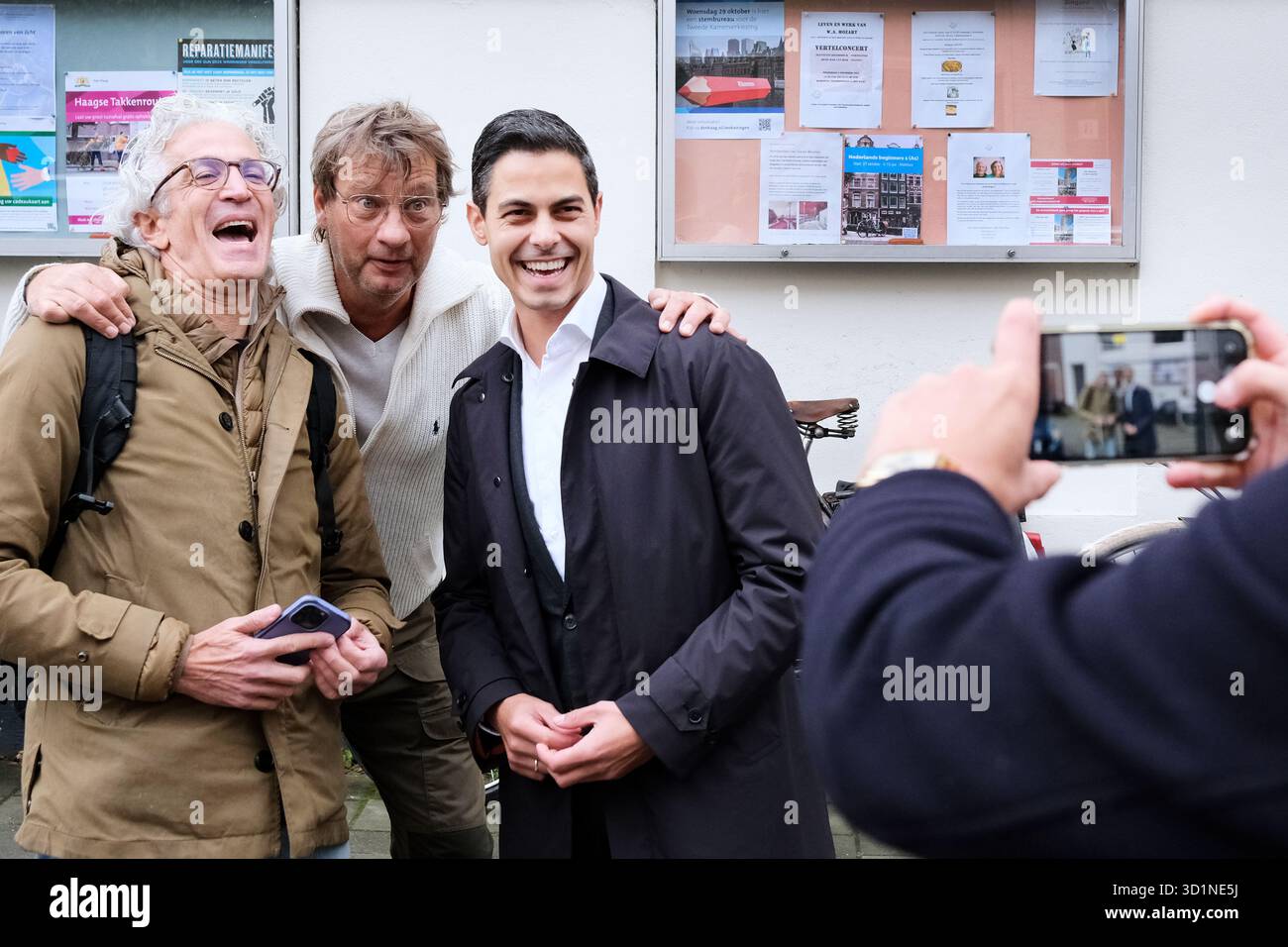 Rob Jetten, leader of the center-left D66 party, right, poses for a mobile phone photo as he ...