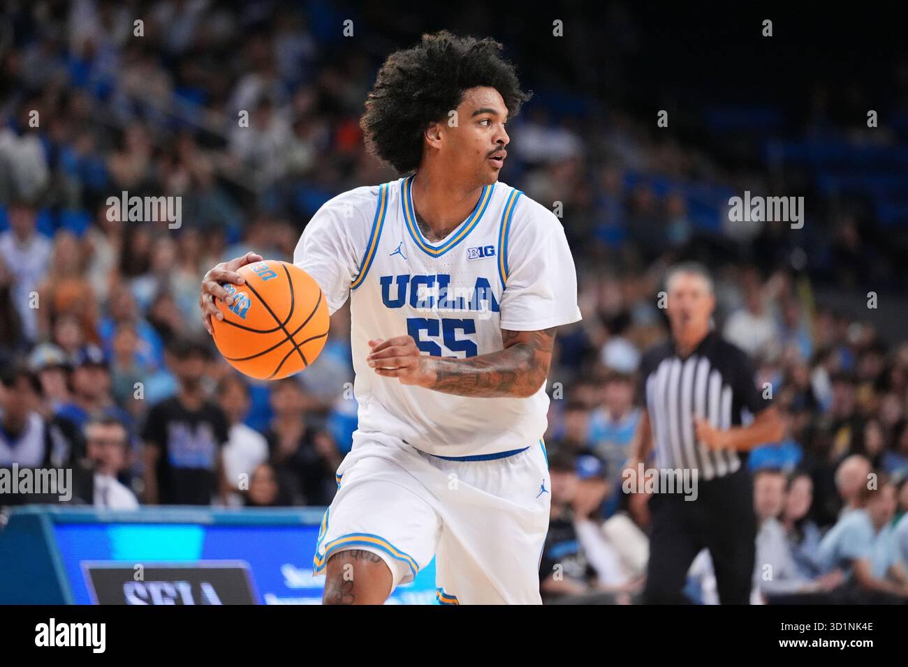 UCLA guard Skyy Clark (55) dribbles the ball during the second half of ...