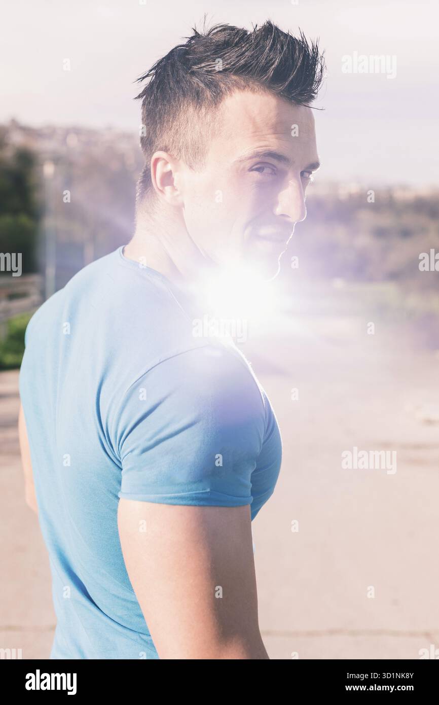 Focused handsome athlete resting after long run Stock Photo - Alamy