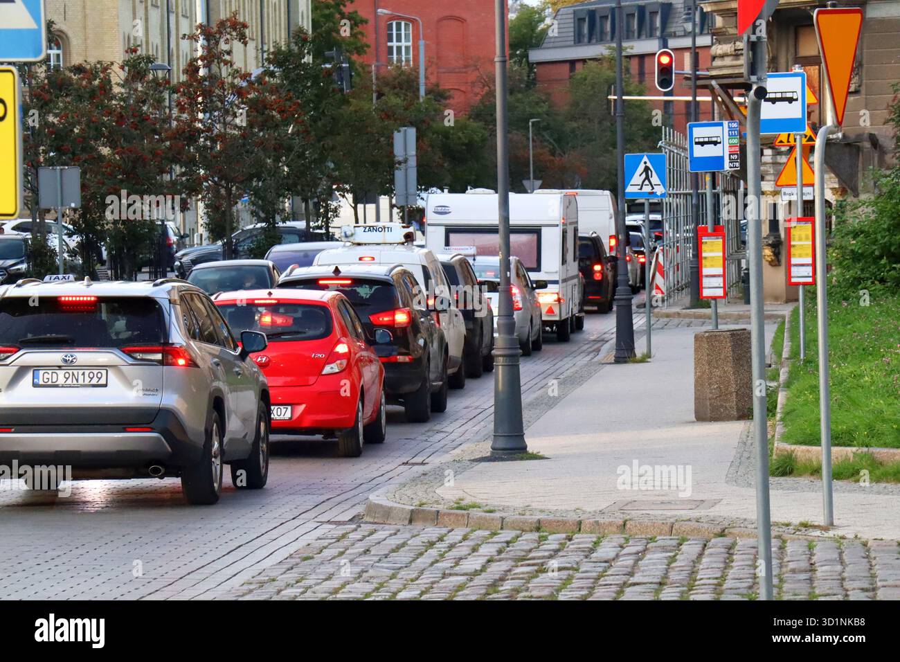 Evening Traffic jam on a city street with cars and bus stops Stock ...