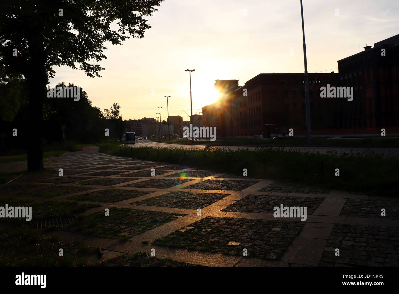 Urban Street at Golden Hour with Sun Flare Stock Photo - Alamy
