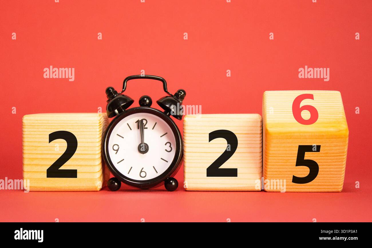 2026 New Year symbol. Businessman turns wooden cube and changes Year ...