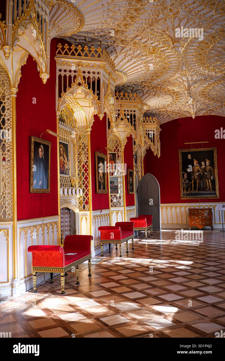 Gothic Revival Hall with Ornate Ceiling and Red Velvet Benches Stock ...
