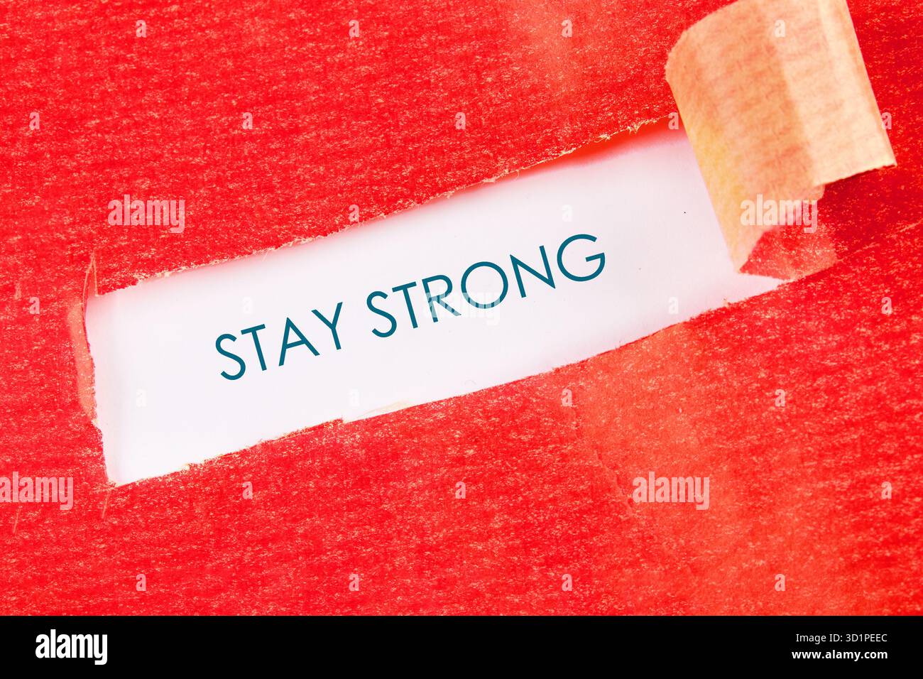 A red surface is torn to reveal a message of encouragement. The words ...
