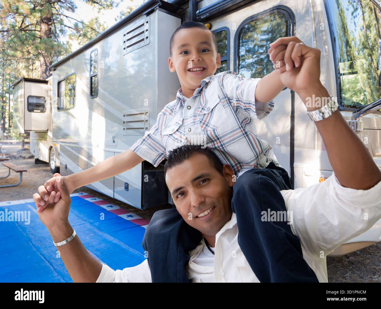 Happy Hispanic Father and Son In Front of Their Beautiful RV At The ...