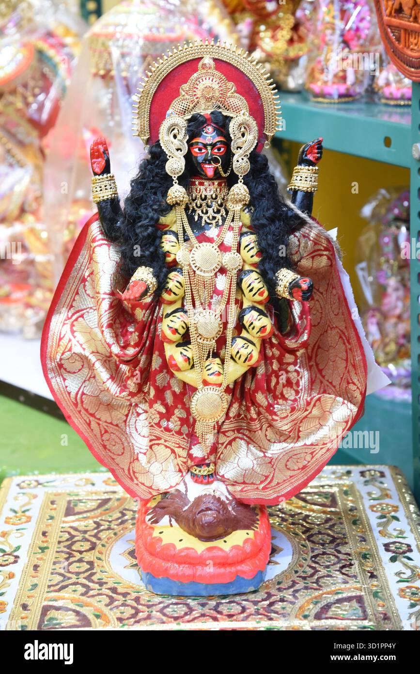 10/14/2025 An artisan gives the final touches to an idol of the Hindu ...