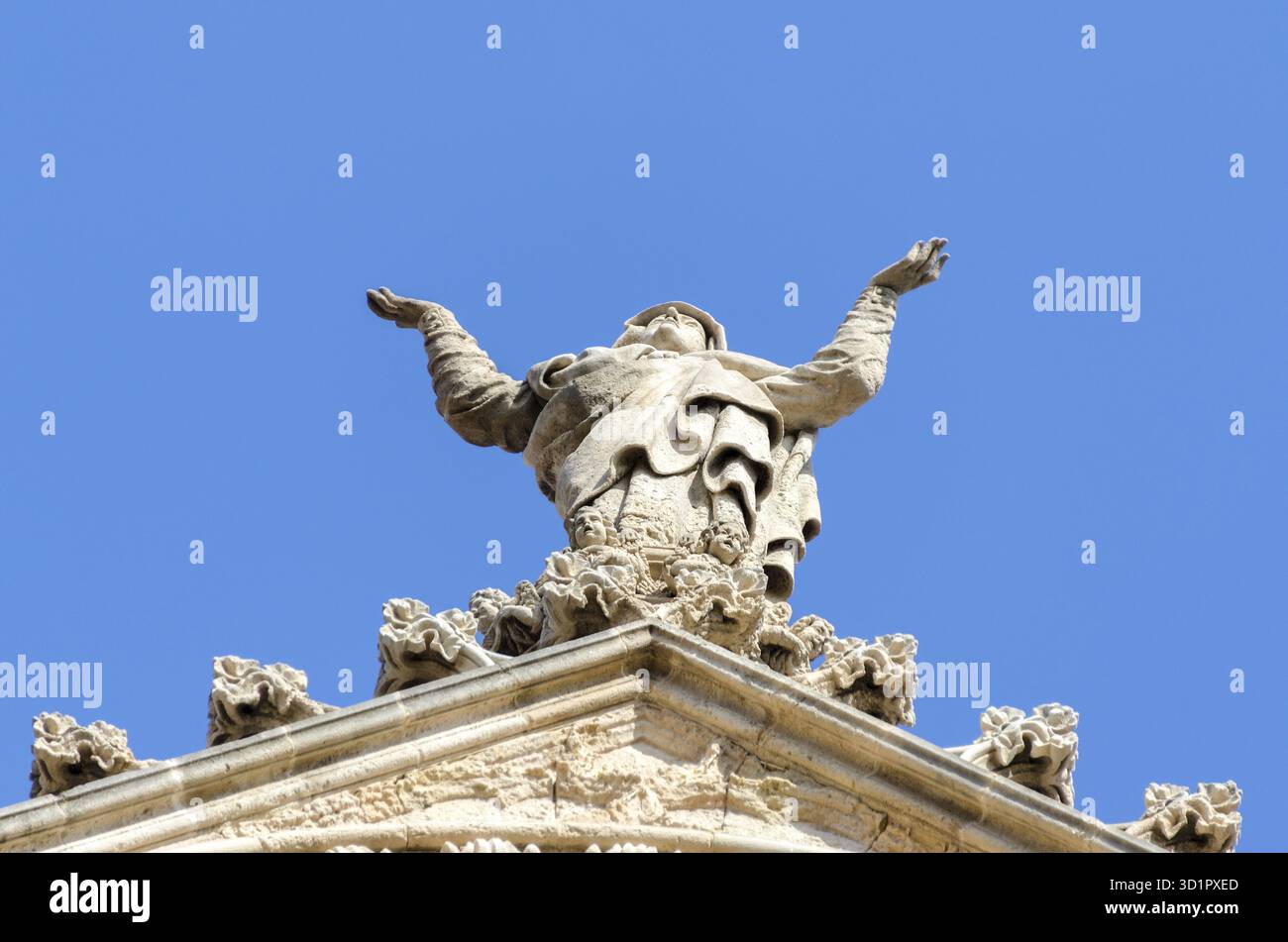Details of roof church facade in Spain. Praying woman statue Stock ...