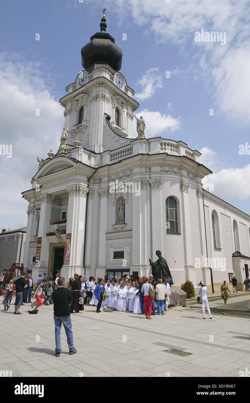 Children with parents on the First Communion Day at the front of parish ...