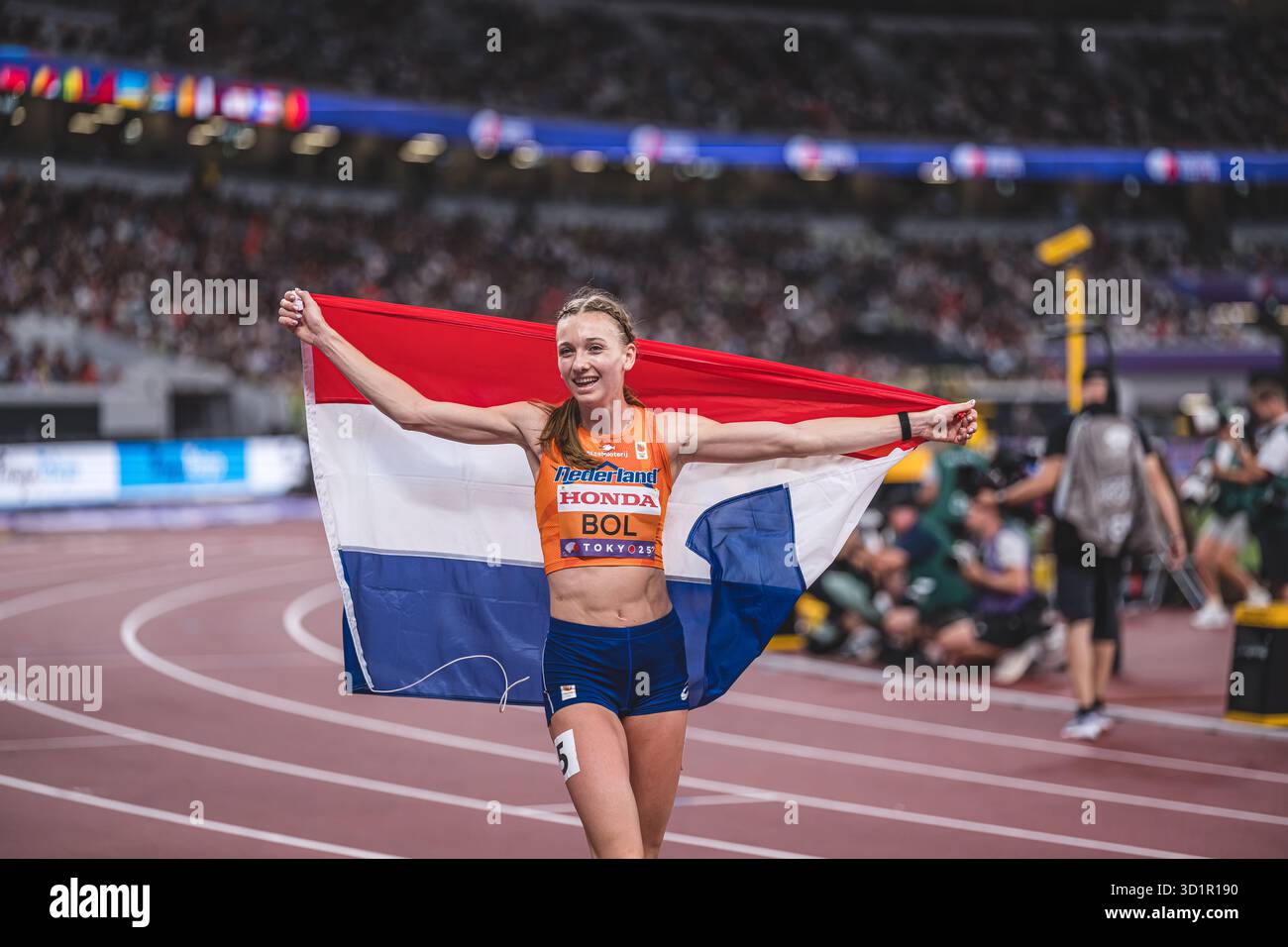 Femke Bol celebrating her medal with her country's flag at the 2025 ...