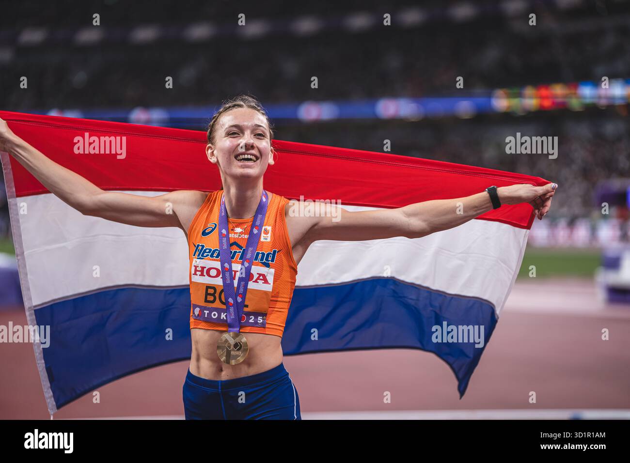 Femke Bol celebrating her medal with her country's flag at the 2025 ...