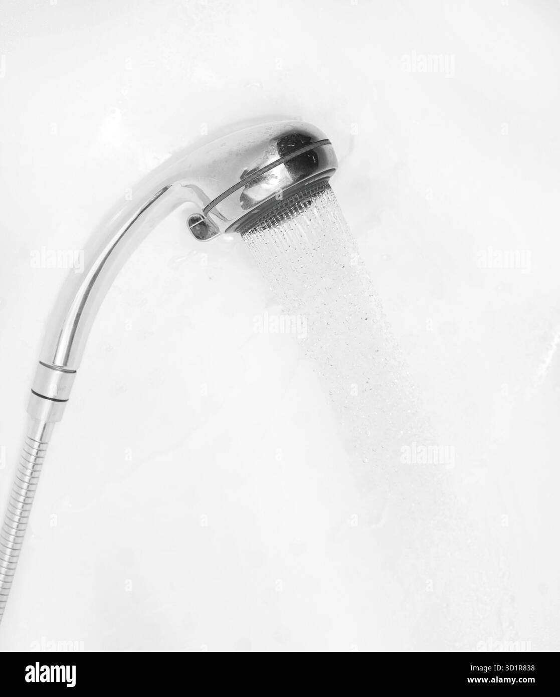 Shower handle with water drops in bath on white background Stock Photo ...
