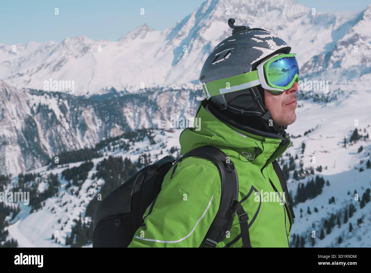 Skiing, portrait of happy male skier on top of mountain Stock Photo - Alamy
