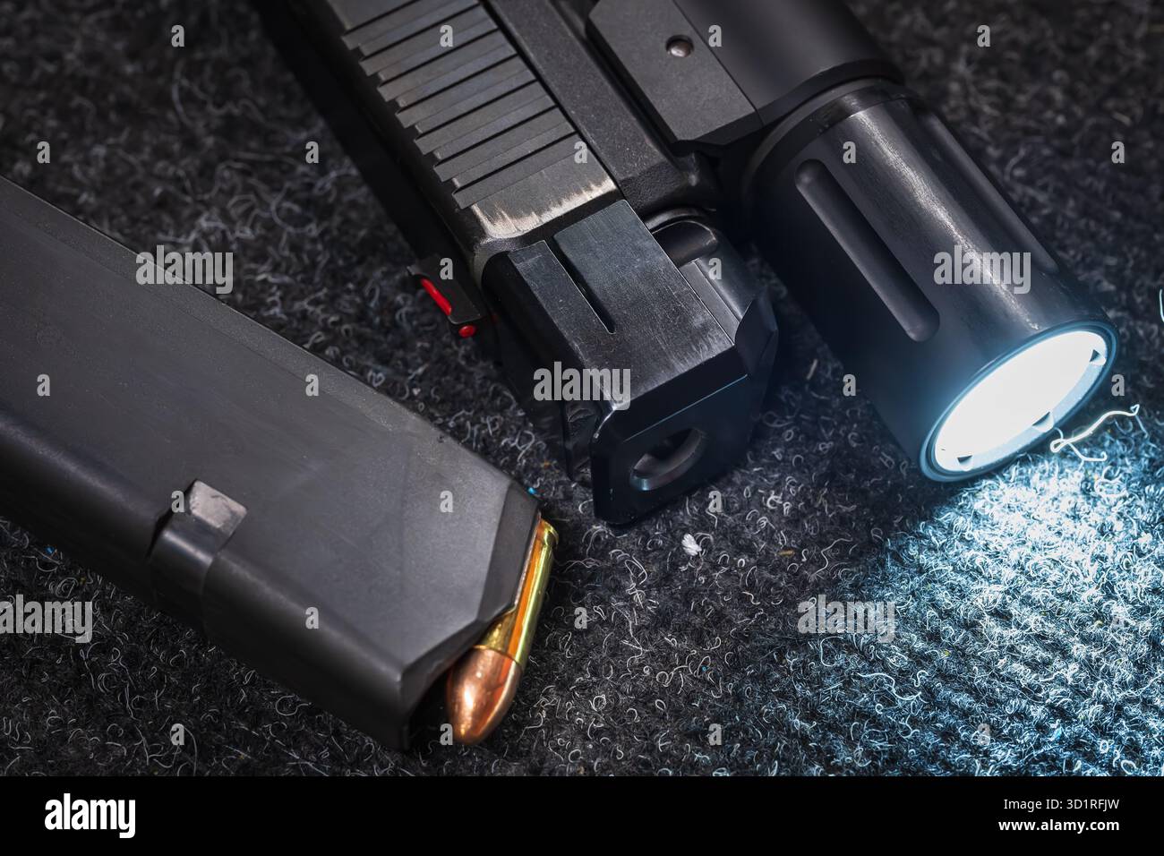 Close-up of a customized 9mm pistol featuring a muzzle brake, tactical ...