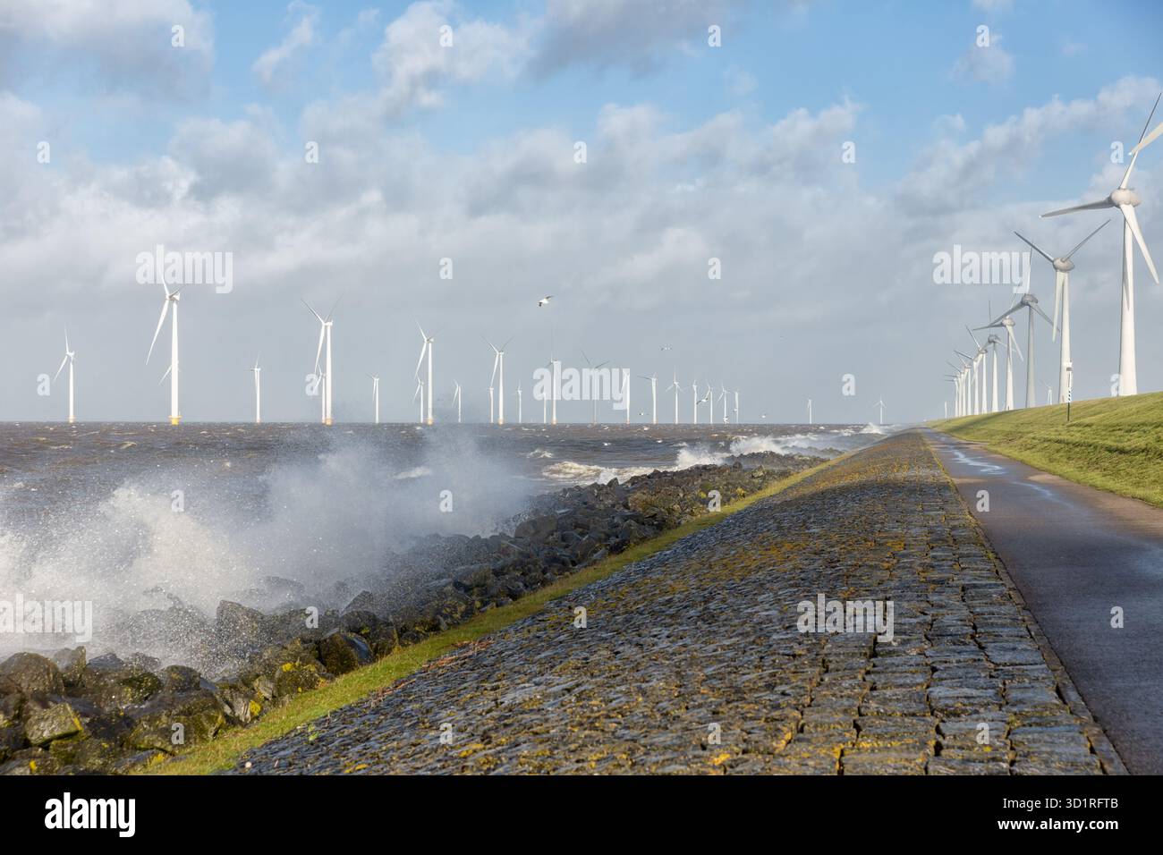 Dutch sea with off shore wind turbines and breaking waves Stock Photo ...