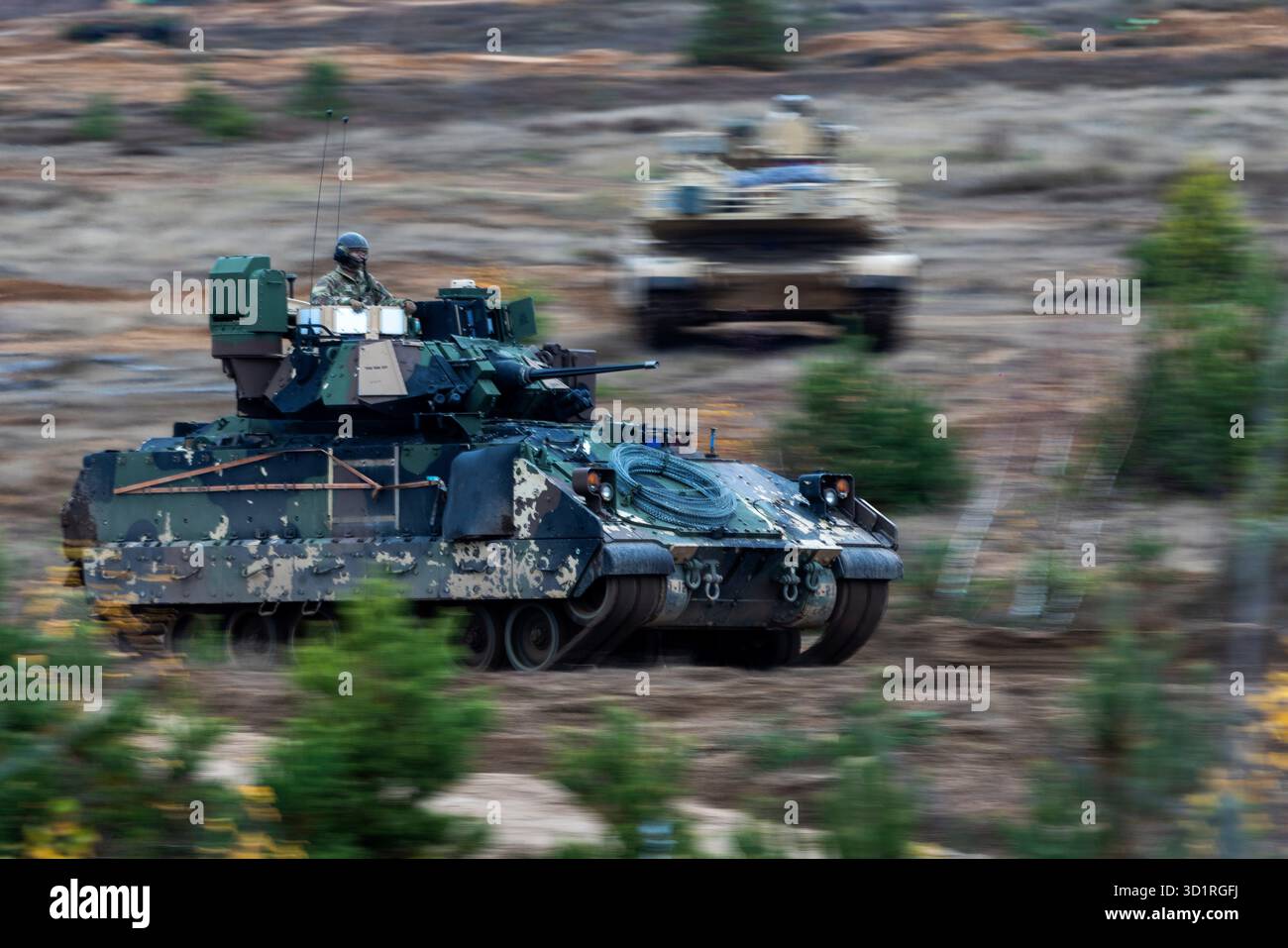 U.S. soldiers ride on an Bradley Fighting Vehicle during a combined ...