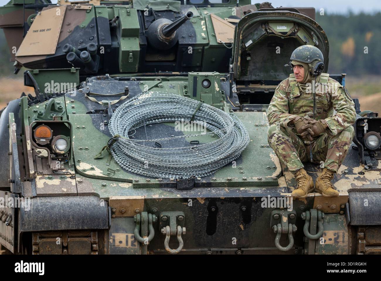 A soldier from the U.S. Army rests during a combined arms live fire ...