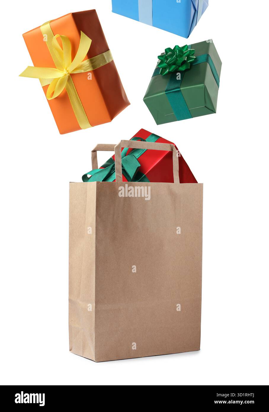 Many gift boxes falling into paper bag on white background Stock Photo ...