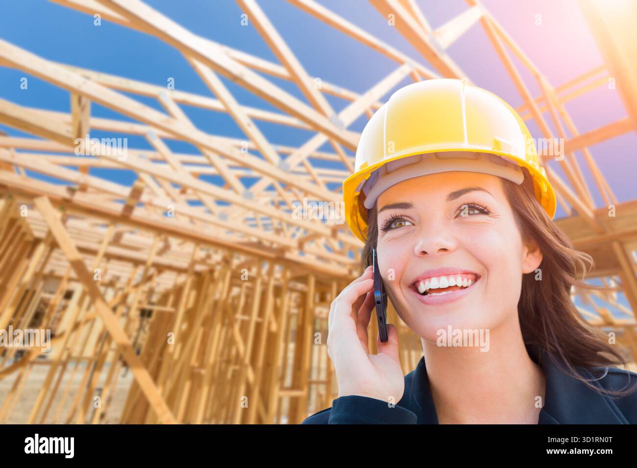 Female Contractor In Hard Hat Using Cell Phone At Construction Site ...