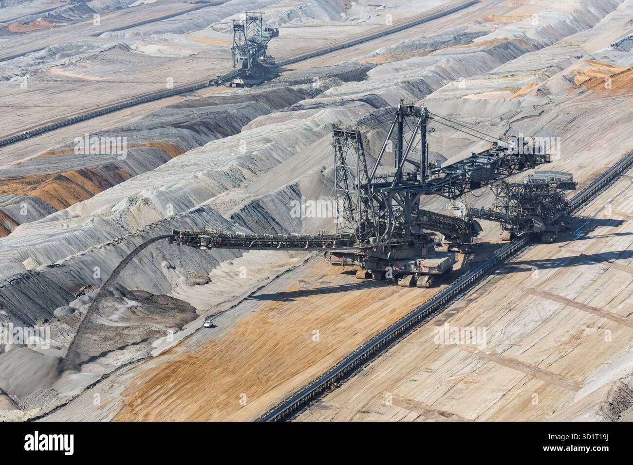Digging machine busy with deposit of unused soil in Hambach open pit ...