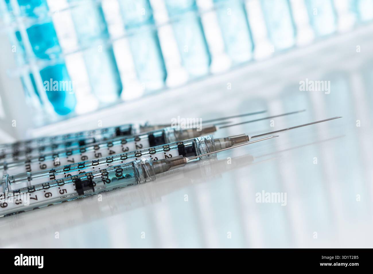 Abstract of Scientific Needle Syringes and Test Tubes Containing Blue ...