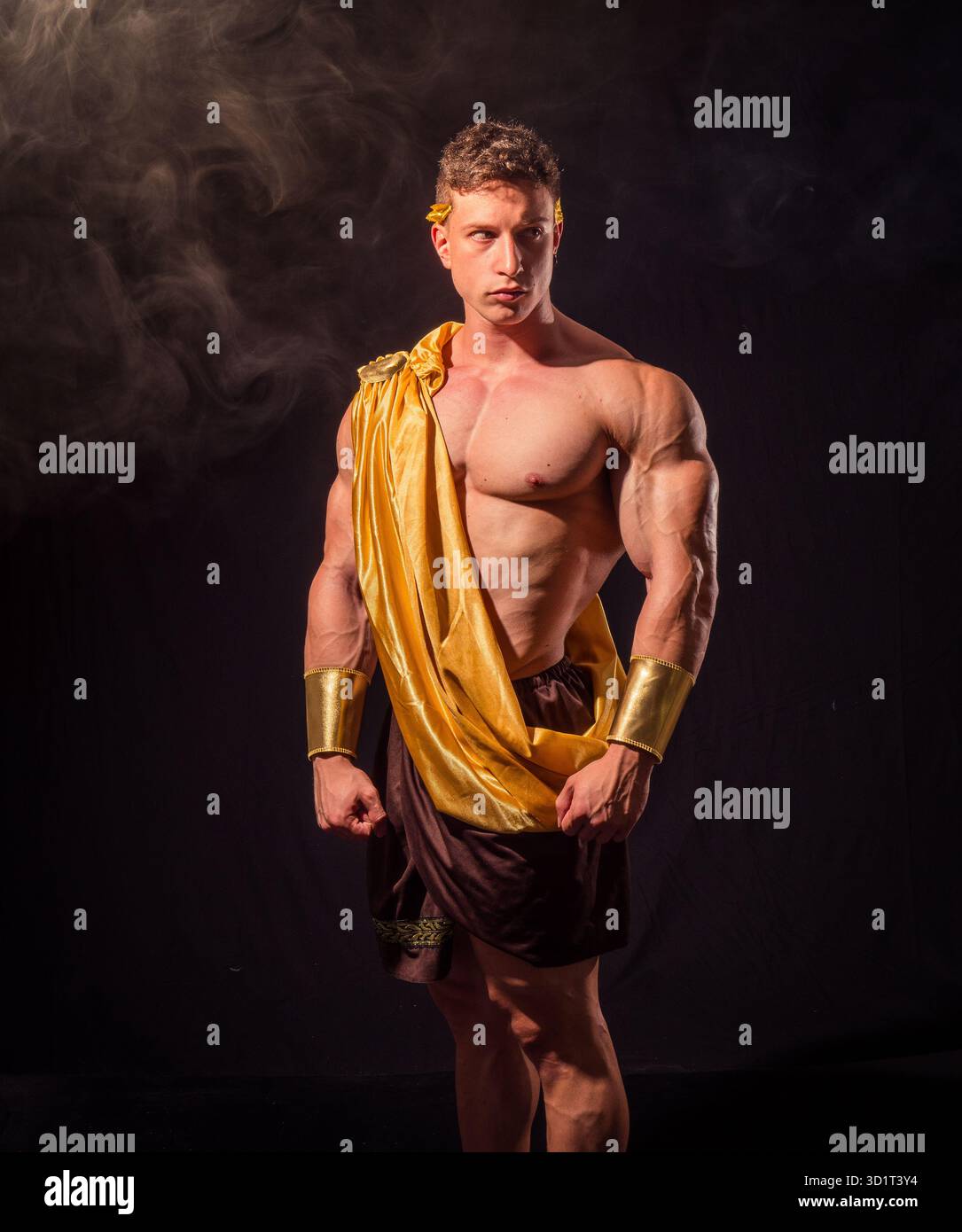 Serious young man in Greek god or Roman aristocrat costume with ...