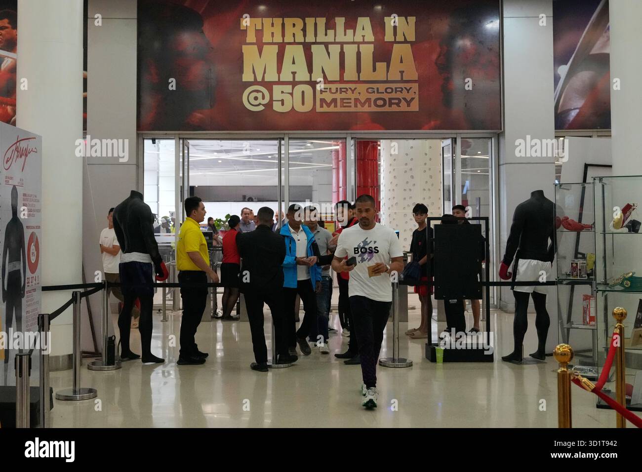 Fans enter the venue, Wednesday, Oct. 29, 2025, in Quezon City ...