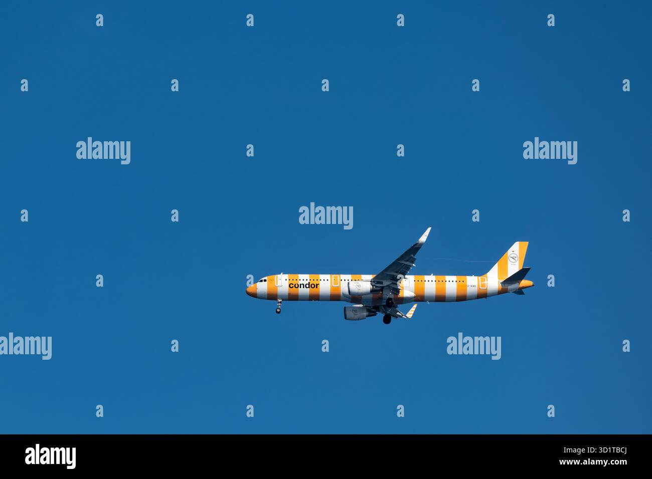 Rhodes Greece. An orange striped Condor Airlines plane on its approach ...