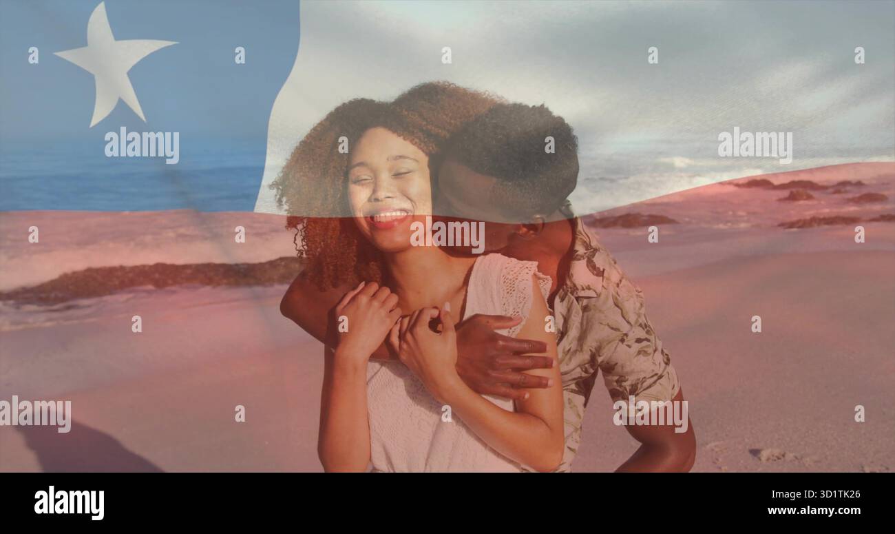 Wrapping arms around woman and kissing her neck at beach water's edge ...