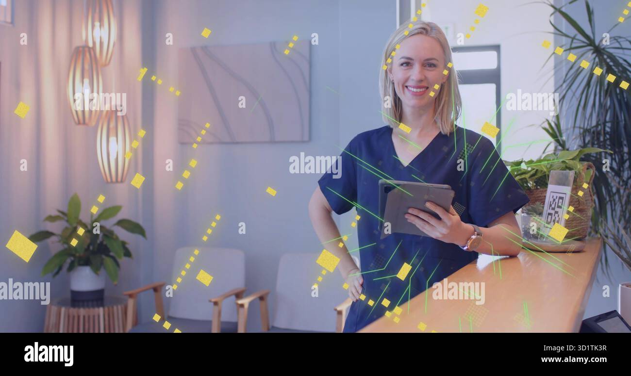 Standing female medical professional holding tablet behind wooden desk ...