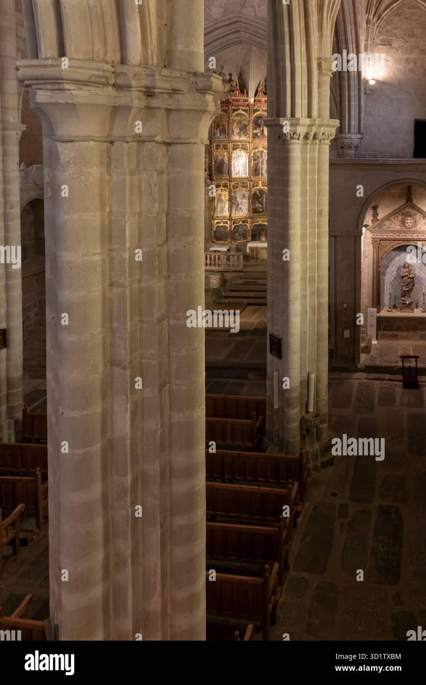 Interior of a historic church showing pillars, pews, an altar, and ...