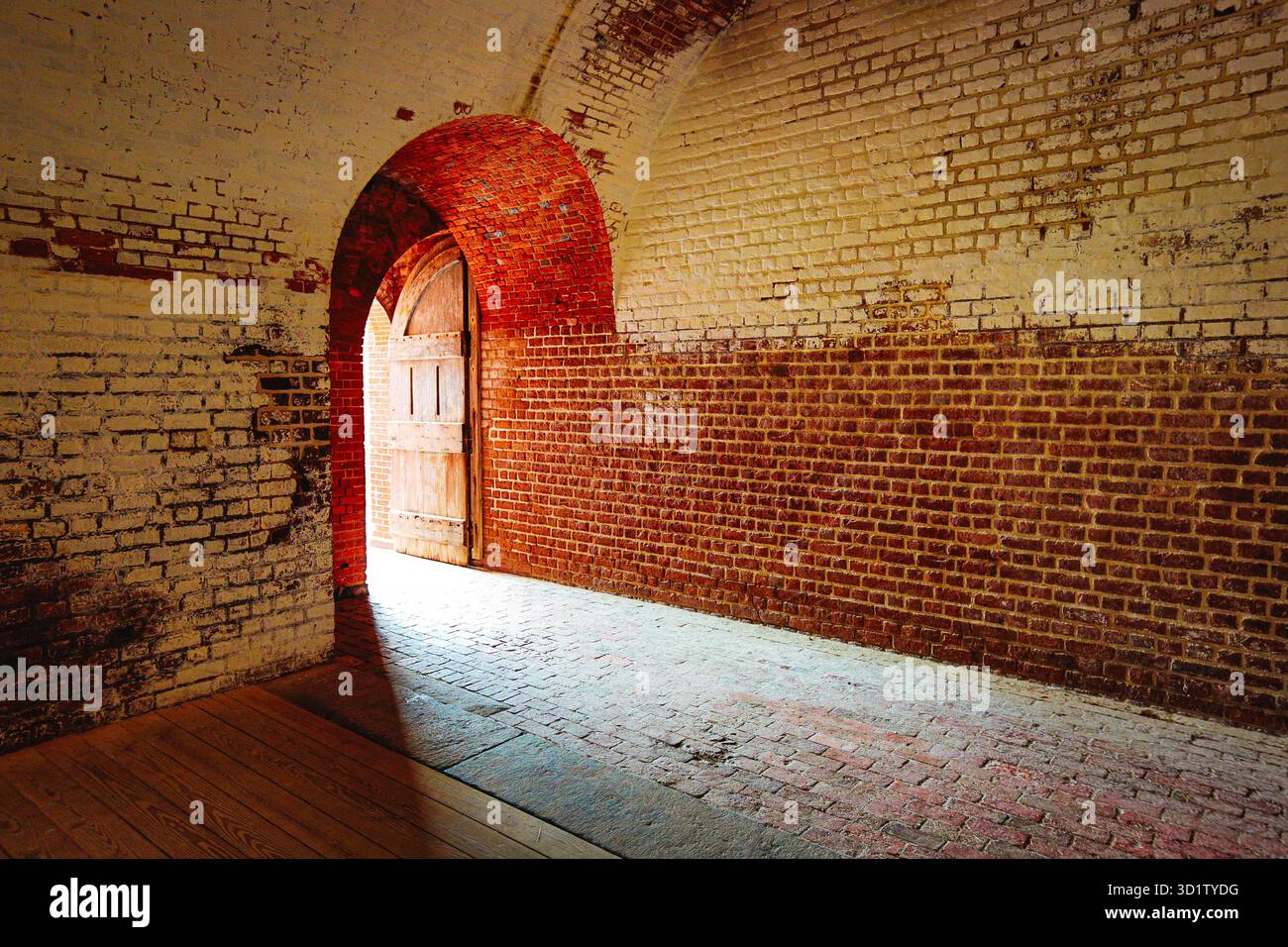 Fort Pulaski interior with arched doorway, Weathered red and white ...
