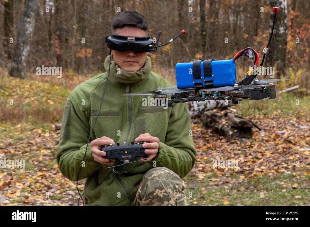 A serviceman of Ukraine's 72nd motorized brigade checks an FPV drone at ...