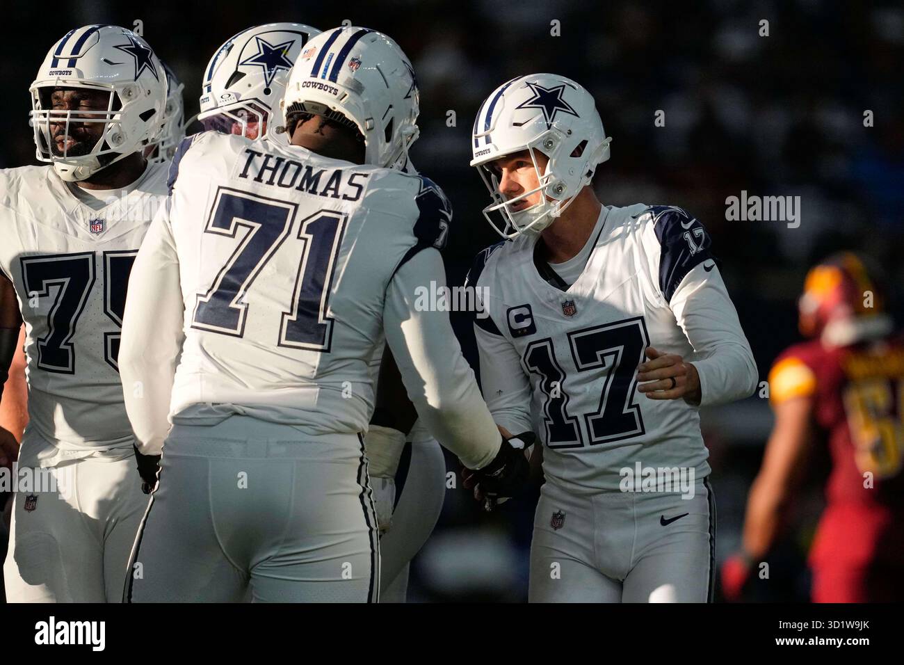 Dallas Cowboys' Brandon Aubrey (17) and Nate Thomas (71) celebrate a ...