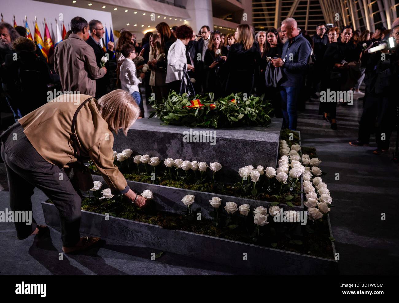 Relatives of the victims lay white roses during the tribute to the ...