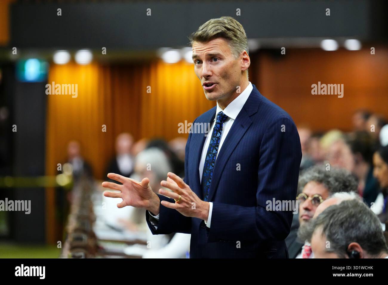Minister of Housing and Infrastructure Gregor Robertson rises during ...