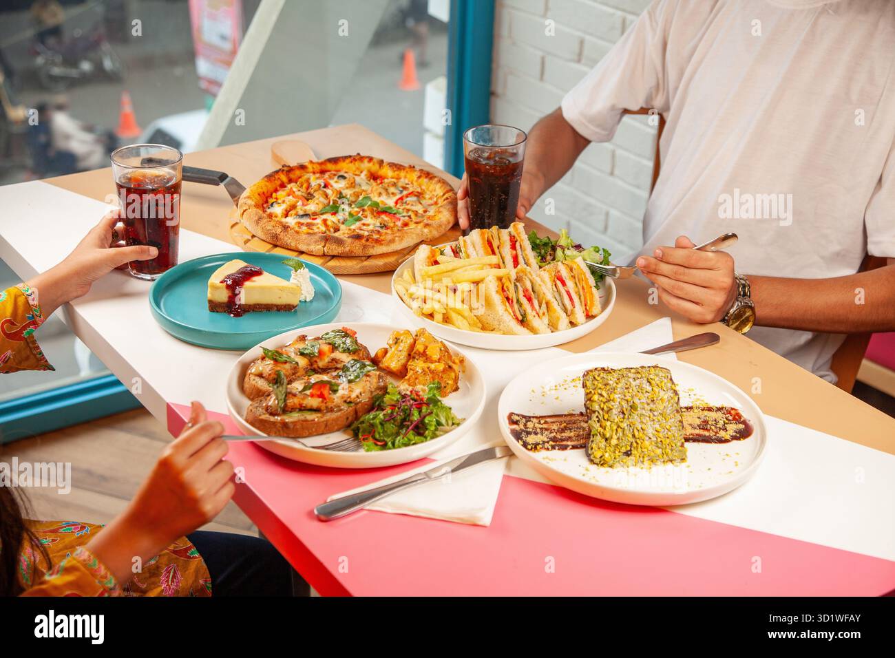 Restaurant café feast serving bruschetta and club sandwiches with hand ...