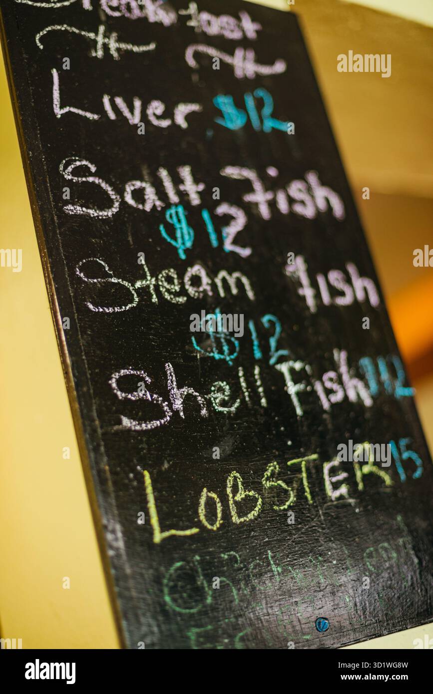 A handwritten chalkboard menu at a Virgin Islands restaurant Stock ...