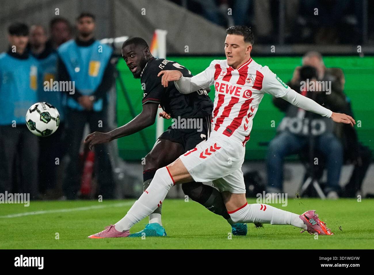 Cologne's Said El Mala, right, and Bayern's Dayot Upamecano challenge ...