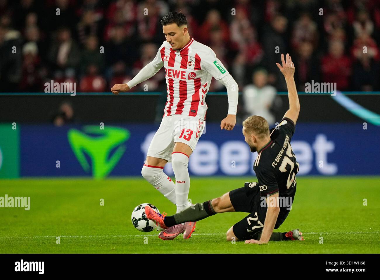 Cologne's Said El Mala, left, and Bayern's Konrad Laimer challenge for ...